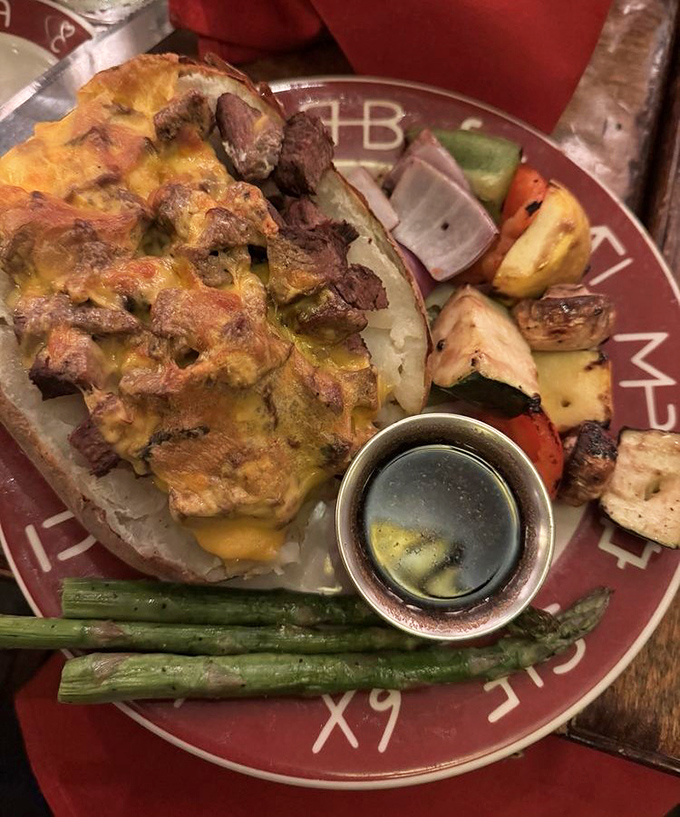 The loaded baked potato isn't just a side dish – it's practically a main event, dressed for success with all the fixings.