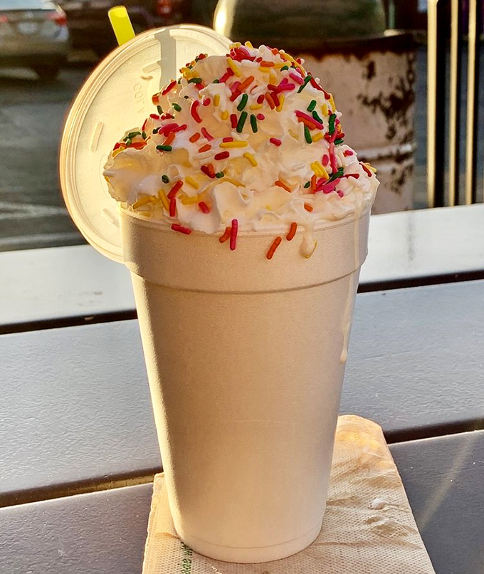 This isn't just a milkshake; it's a celebration in a cup. Rainbow sprinkles are the confetti at this party of vanilla bliss.