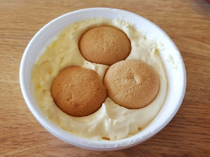Banana pudding with vanilla wafers standing at attention &ndash; the kind of comfort food that makes you want to hug whoever made it.