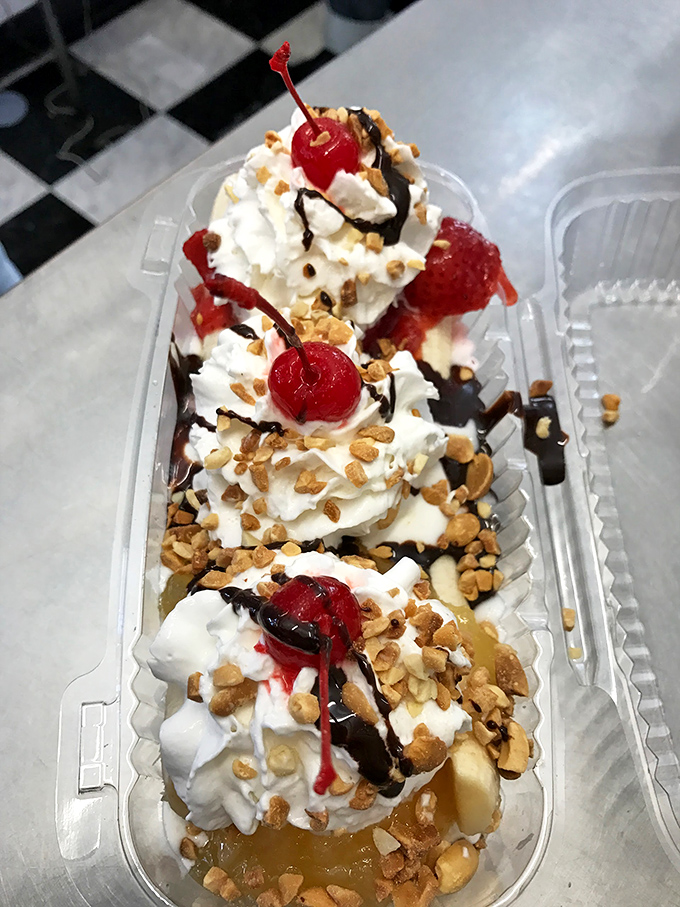 This banana split isn't just dessert&mdash;it's an architectural marvel of whipped cream, cherries, and nuts that demands to be photographed before devoured.