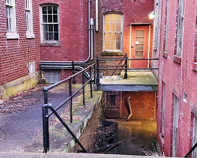 The basement entrance, where two worlds meet. Stairs descending into darkness hint at the facility's most closely guarded secrets.