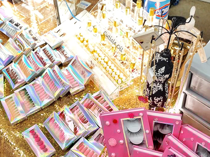 Beauty supplies arranged like a makeup artist's dream palette. False eyelashes and glitter for days&mdash;glamour at flea market prices!