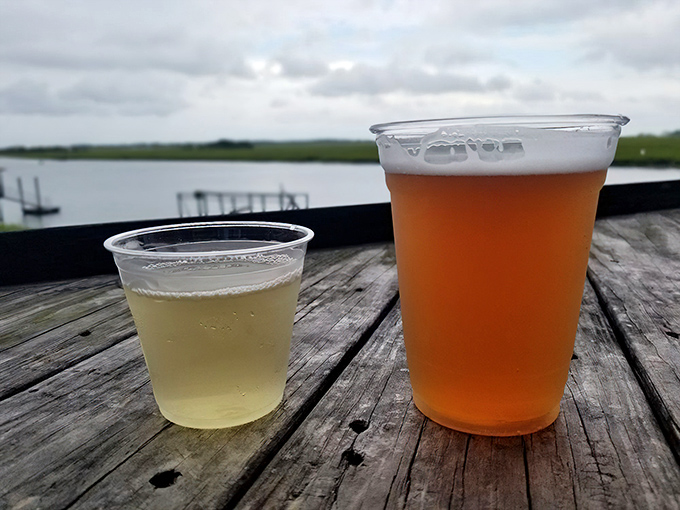 Cold beer with a side of spectacular marsh views—nature's perfect pairing for whatever seafood treasure you've ordered.