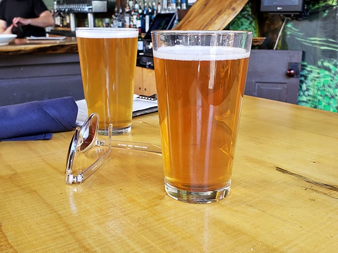 Two beers catching the light like liquid amber jewels&mdash;proof that sometimes the simplest pleasures are worth pausing your day for.