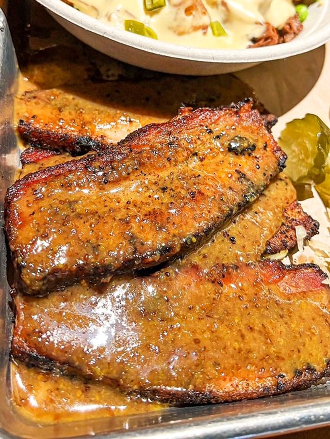 Pork belly so perfectly rendered and glazed, it makes you question every life decision that didn't involve eating this sooner. The glistening surface promises flavor nirvana. 