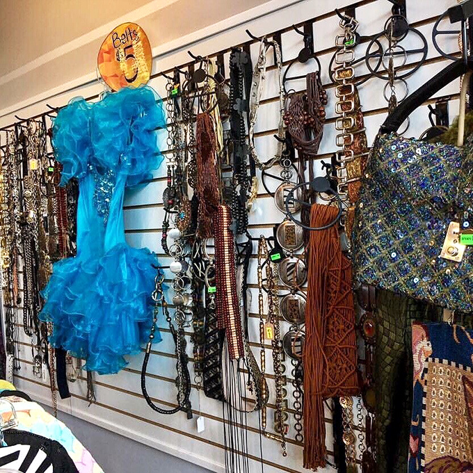 Accessories that transform outfits from "nice" to "where did you get that?!" This wall of belts and statement pieces is jewelry for your clothes.