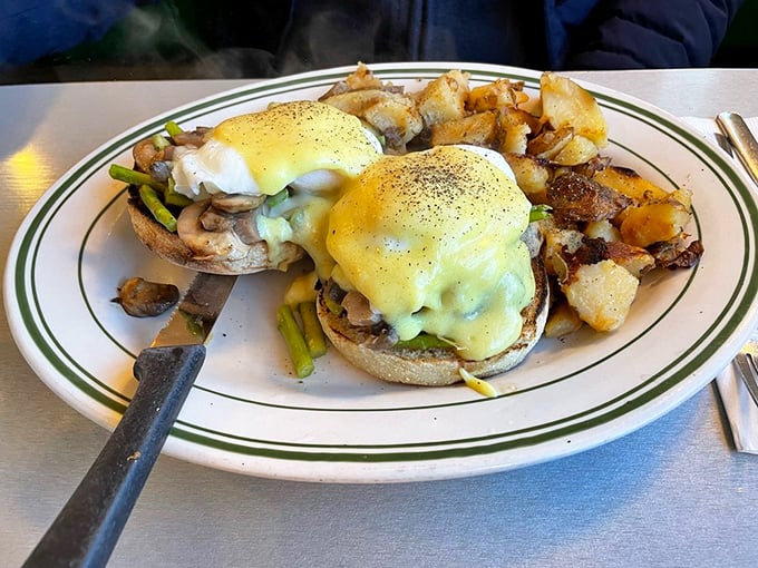 Benedict perfection: English muffins supporting poached eggs and hollandaise like architectural marvels of the breakfast world.