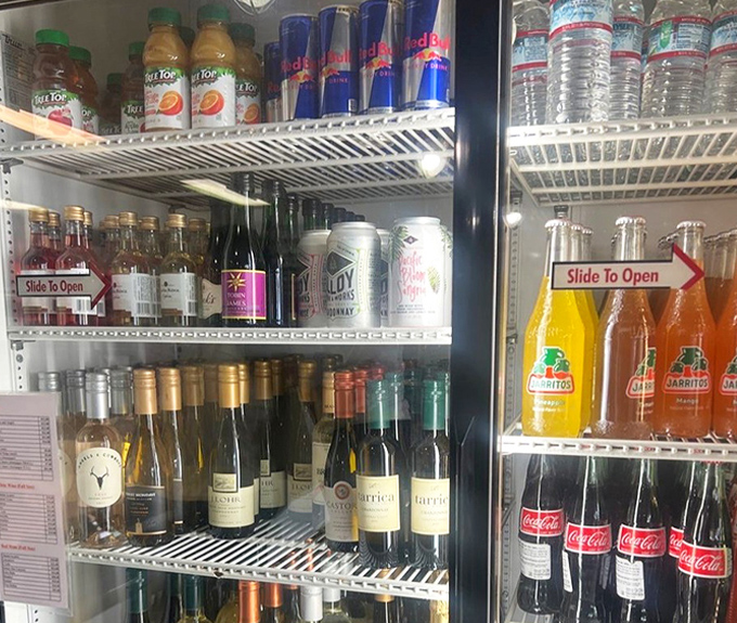 The beverage cooler: where local wines meet classic sodas in peaceful coexistence. Choose your adventure &ndash; pinot noir or a Mexican Jarritos?