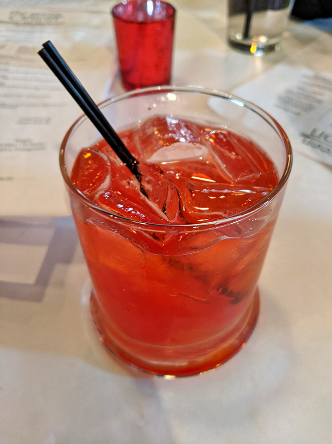 A ruby-red cocktail that promises refreshment with a kick&mdash;the perfect companion while deciding between all those seafood options.