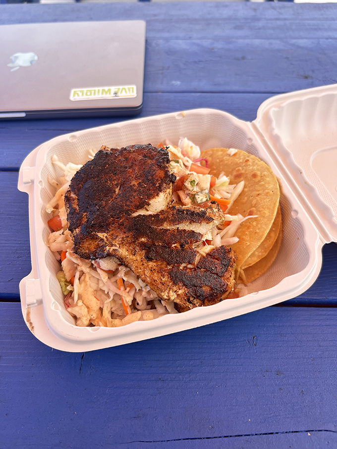 Blackened to perfection, this fish creation sits atop a mountain of homestyle fries. The kind of meal that makes you contemplate moving closer.