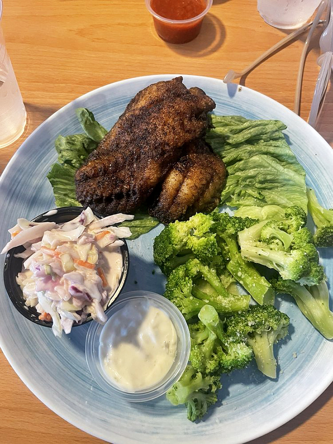 Blackened grouper with a side of broccoli and slaw&mdash;proof that sometimes the healthier option is also the most satisfying. That seasoning crust deserves its own fan club.