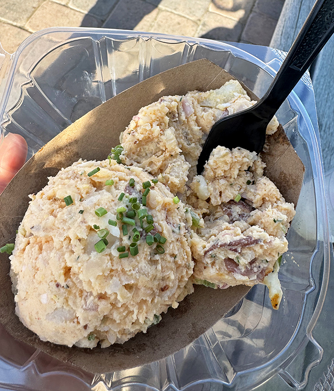 Potato salad that knows its role – the cool, creamy counterpoint to barbecue's intensity. Like Danny DeVito to Arnold Schwarzenegger, it completes the picture.