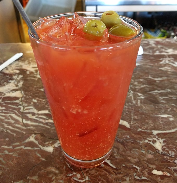A Bloody Mary garnished with olives&mdash;the breakfast of champions' liquid sidekick. That vibrant red promises both virtue (tomato) and vice (vodka).