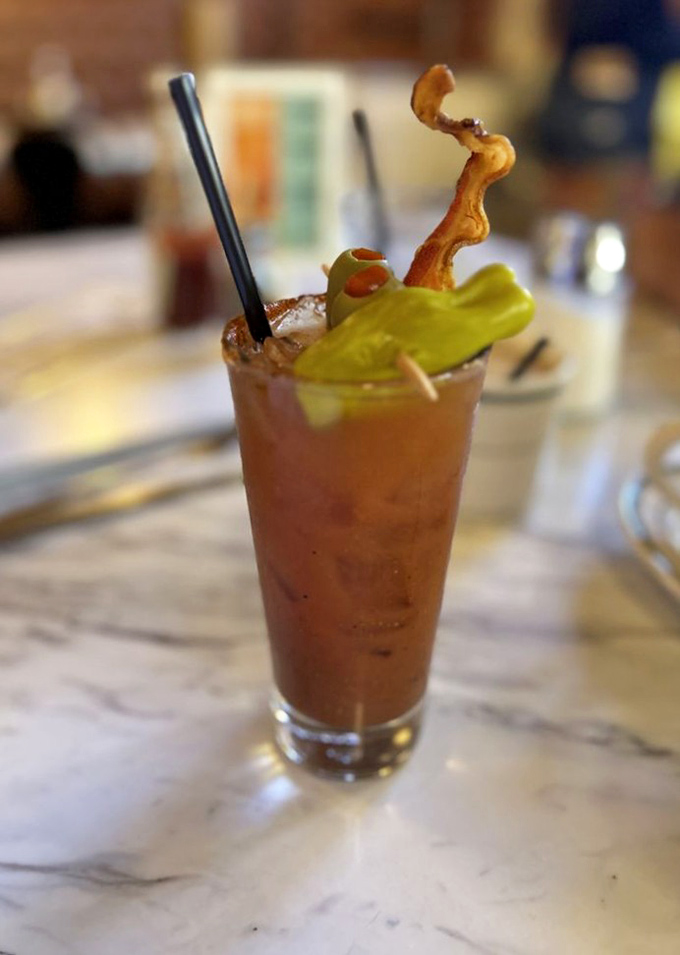 This Bloody Mary isn't just a drink&mdash;it's a meal with a kick. That bacon garnish is doing a victory lap around the glass.