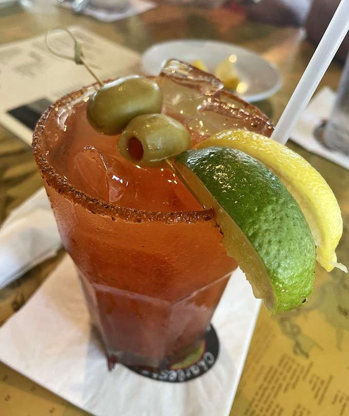A Bloody Mary adorned like it's heading to seafood prom &ndash; those olives and citrus aren't just garnish, they're fashion accessories.
