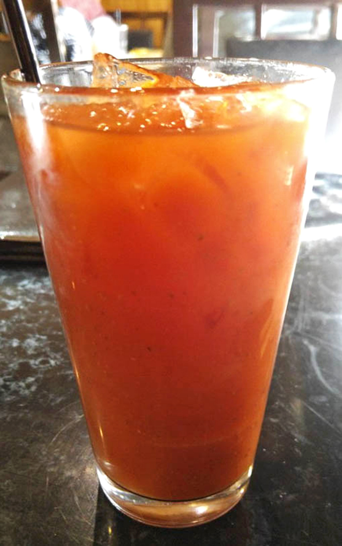 This isn't your grandmother's tomato juice. The Bloody Mary here arrives like a spicy liquid appetizer, ready to kickstart conversations and appetites alike.