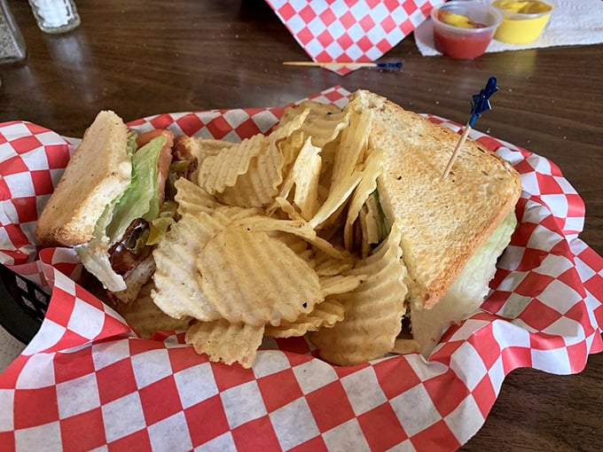 A sandwich that understands the importance of proper architecture &ndash; sturdy bread, generous fillings, and those ridged chips standing guard.