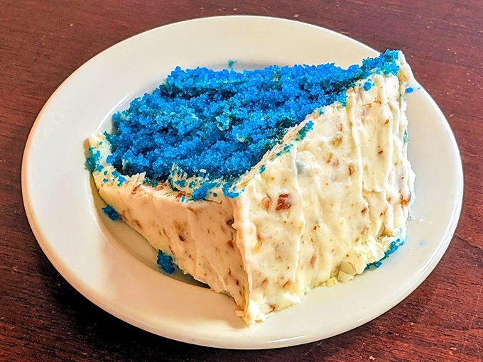Blue velvet cake that would make Elvis swoon. The electric blue crumb contrasts with cream cheese frosting in a dessert worth saving room for.