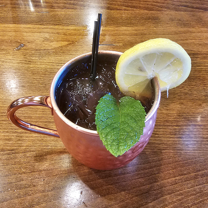 A copper mug Moscow Mule with fresh mint and lemon &ndash; because sometimes you need something bright and zippy to cut through all that smoky richness.