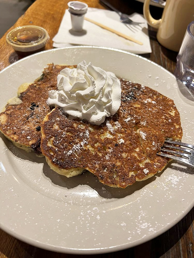 Plot twist: these aren't pancakes at your average diner&mdash;they're blueberry ricotta pancakes with a dollop of whipped cream that screams "breakfast of champions."