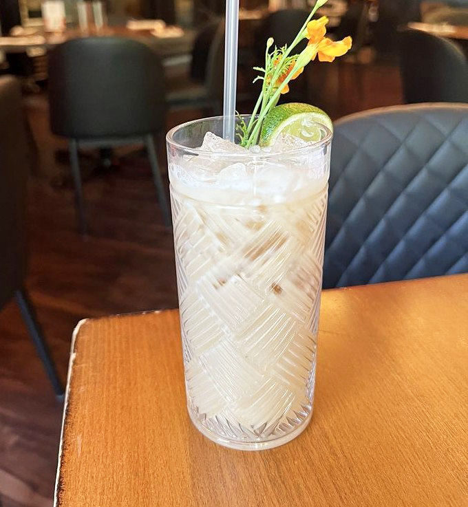 The Bouake Mocktail arrives like a refreshing oasis, garnished with lime and edible flowers &ndash; proof that alcohol-free can still be party-ready.