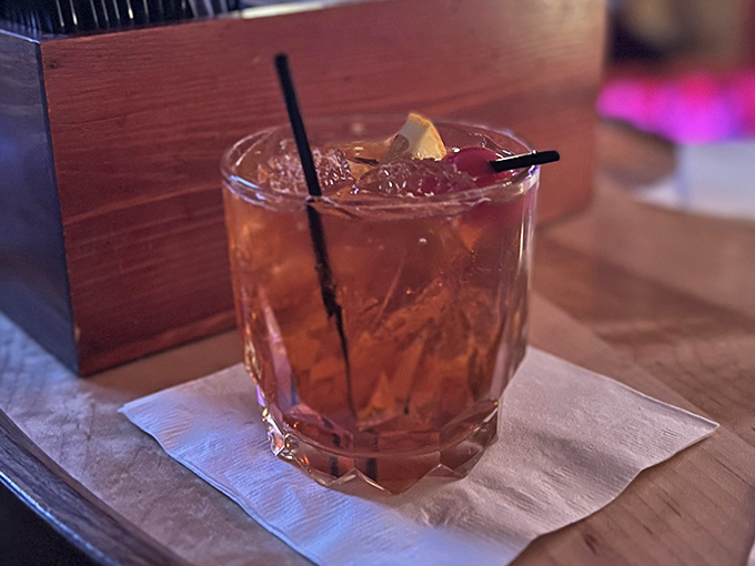A proper brandy old fashioned, glowing amber in its glass like liquid Wisconsin sunshine on ice.