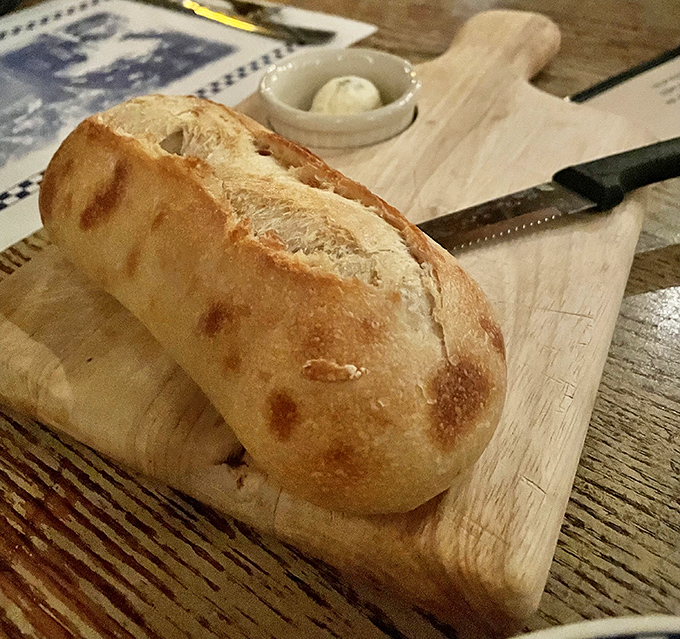 This isn't just bread &ndash; it's the opening act that sets the tone for the entire meal, crusty exterior giving way to pillowy perfection.