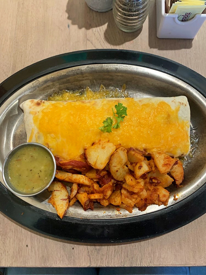 This breakfast burrito isn't just food&mdash;it's a warm, chile-smothered hug that makes you forget all your problems, at least until the last bite. 