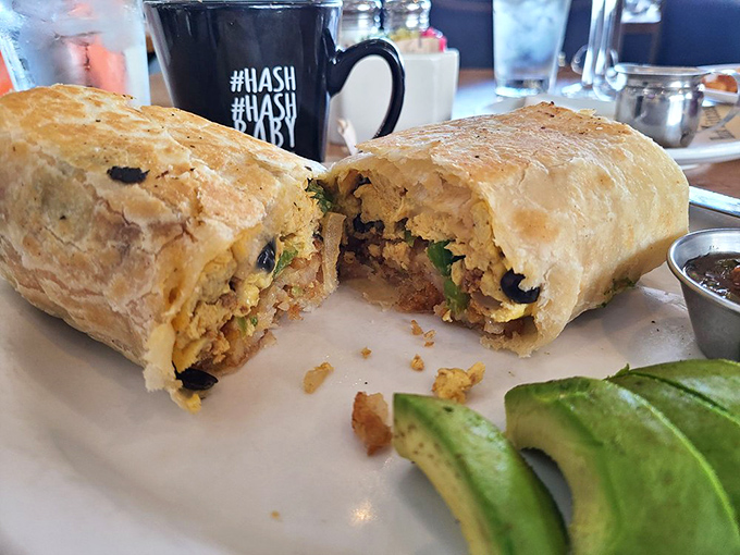 Breakfast burritos elsewhere just called in sick. This handheld masterpiece is packed tighter than airport security lines on Thanksgiving.