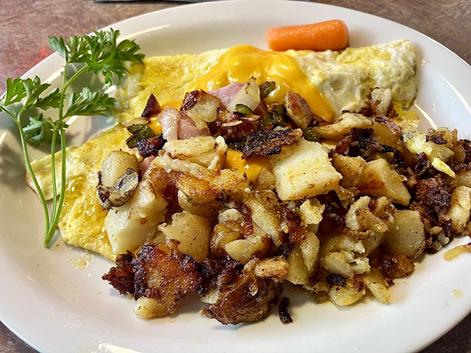 Breakfast artistry at its finest&mdash;crispy potatoes, fluffy eggs, and that perfectly placed parsley saying, "Yes, this is actually gourmet."