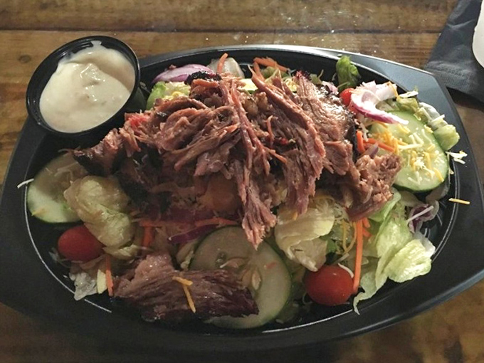 A salad that doesn't apologize for being healthy because it's crowned with smoky brisket. The lettuce is just there for moral support.