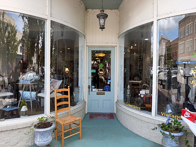 Vintage treasures await behind these curved windows, where that empty chair seems to say, "Take a load off, the antiques aren't going anywhere."