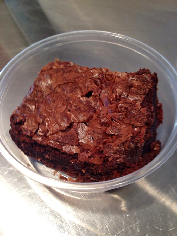 A brownie so dense and fudgy it could have its own gravitational pull. This isn't dessert&mdash;it's chocolate architecture.