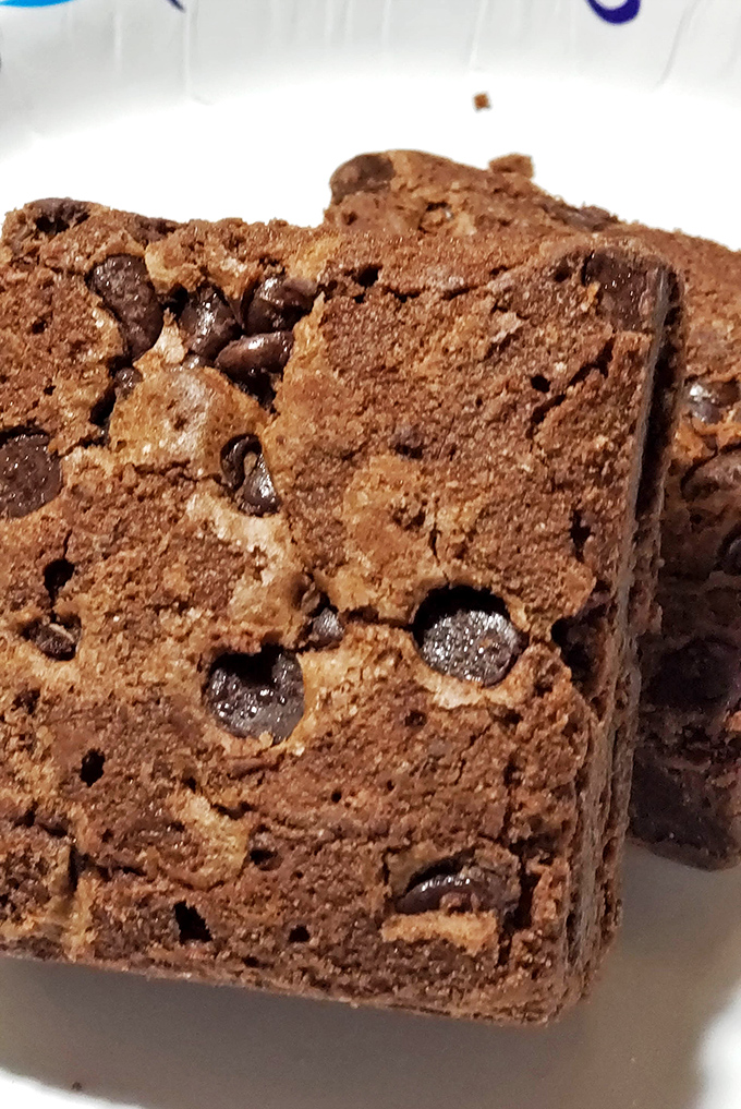 These brownies aren't just dessert; they're chocolate therapy squares with the perfect crisp edge-to-fudgy-center ratio that psychiatrists should prescribe.