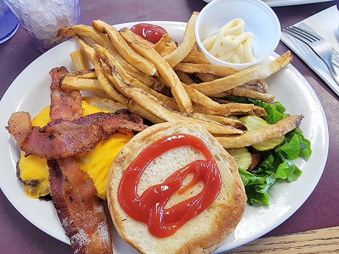 The classic American cheeseburger with bacon&mdash;proof that simplicity, when done right, needs no improvement. Those fries look hand-cut and heaven-sent.