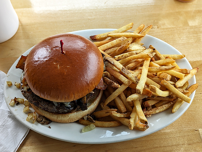 A proper diner burger should require both hands and extra napkins&mdash;this beauty with its glistening bun and mountain of fries doesn't disappoint.