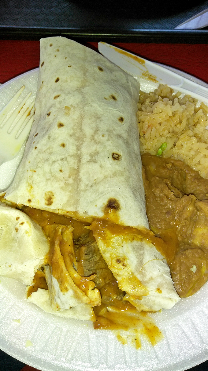 A burrito so generously stuffed, it needs its own zip code and possibly a building permit.