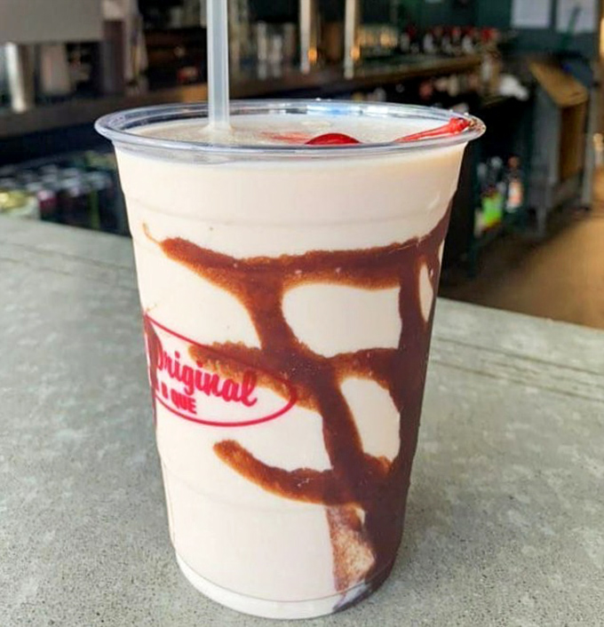 The Bushwacker: part dessert, part cocktail, all vacation in a cup. One sip and you're officially on Alabama time, regardless of what your watch says. 