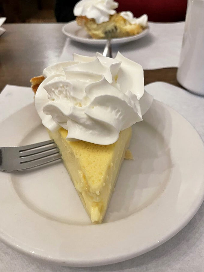 Buttermilk pie topped with a cloud of whipped cream&mdash;the kind of dessert that makes you understand why people used to sit on porches and just be content.