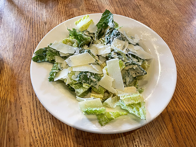 A Caesar salad that Julius himself would approve&mdash;crisp romaine, generous Parmesan shavings, and a dressing that achieves that perfect creamy-tangy balance.