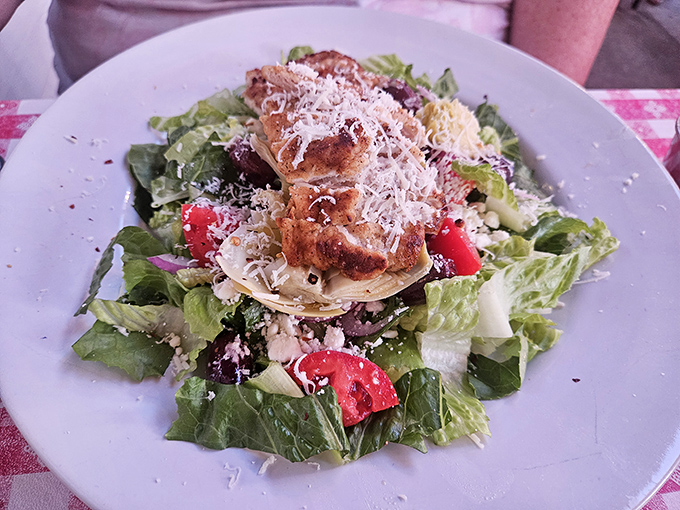 A Caesar salad that Julius himself would cross the Rubicon for, topped with freshly shaved parmesan like snow on the Alps.
