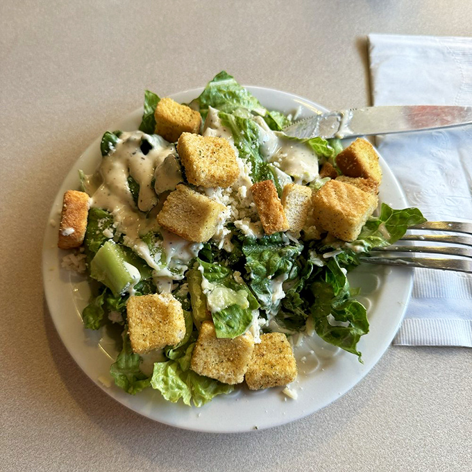 Caesar salad done right &ndash; crisp romaine standing at attention like delicious green soldiers ready for battle.