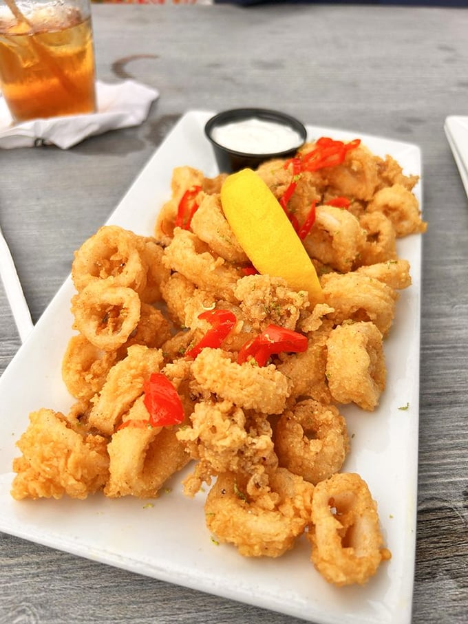 Calamari so perfectly golden and crisp, it makes other fried foods look like they're not even trying. That lemon wedge is about to witness greatness.