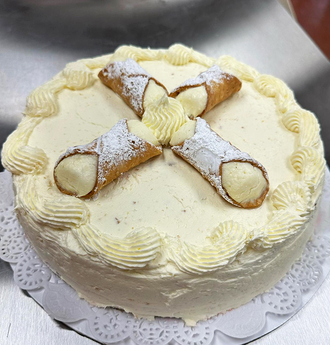 Not just a cake, but a celebration with miniature cannolis as crown jewels. Dessert inception that makes birthday candles entirely optional.