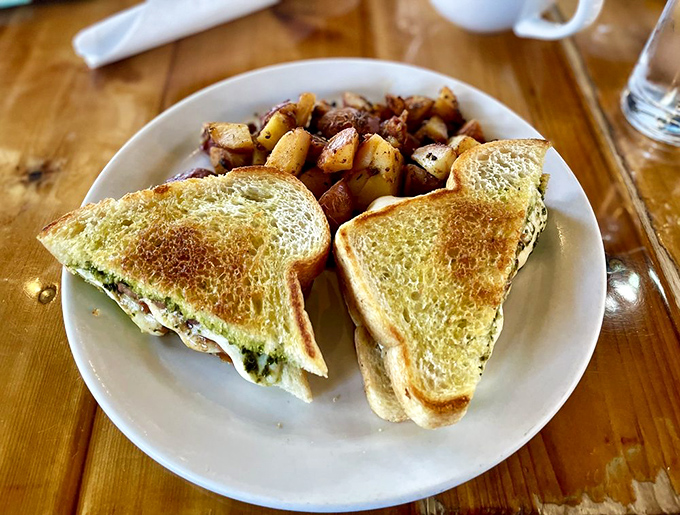 Two perfectly grilled triangles of bread hide a melty Caprese secret&mdash;fresh mozzarella, ripe tomatoes, and basil proving that the humble sandwich can indeed achieve greatness.