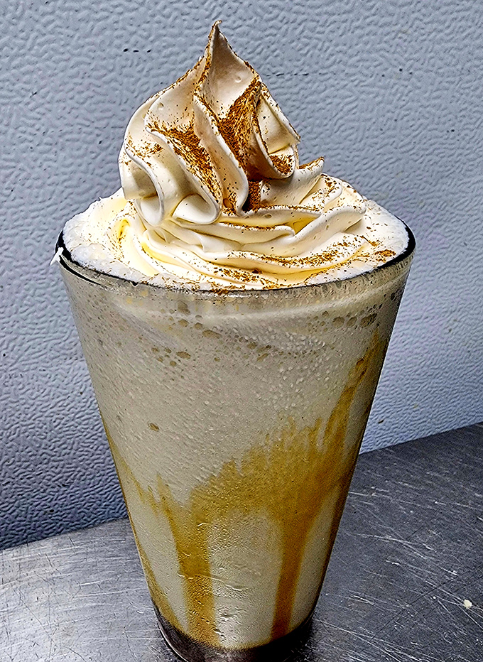 This isn't just a milkshake; it's a frothy tower of happiness with whipped cream architecture that deserves its own blueprint.