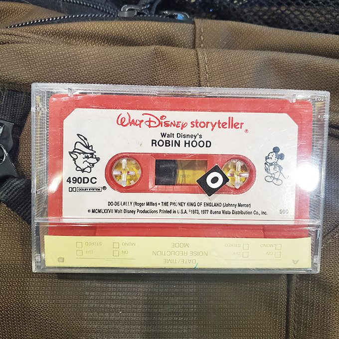 A vintage Disney cassette emerges from the depths, triggering memories of Saturday morning cartoons.