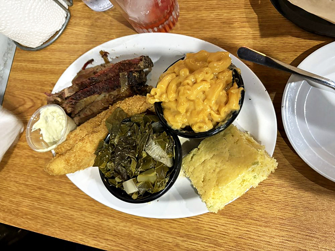 Southern comfort on a plate: tender brisket, greens that have been properly introduced to pork, and mac and cheese that's definitely not from a box.