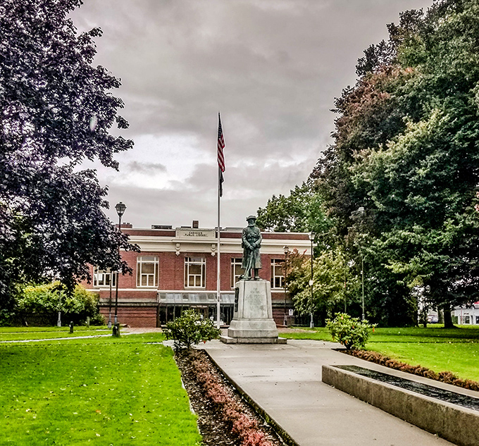 The Centralia Timberland Library and its neighboring statue create that perfect small-town tableau where literature and local history stand side by side, literally.