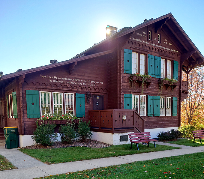 The Chalet of the Golden Fleece Museum showcases authentic Swiss architecture with its wooden balconies, decorative trim, and those unmistakable turquoise shutters.